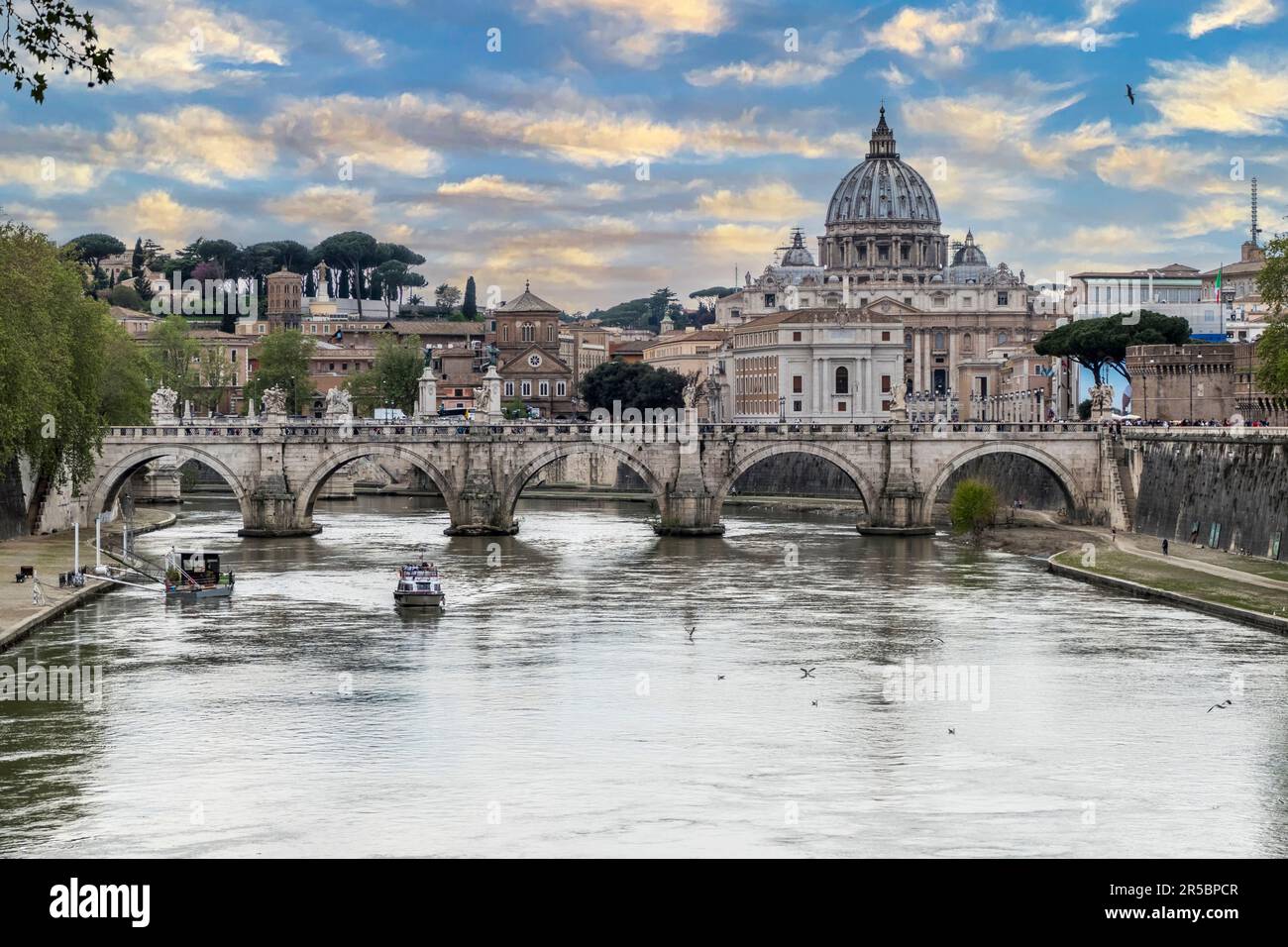 The Tevere river with the Vatican in background at sunset Stock Photo ...