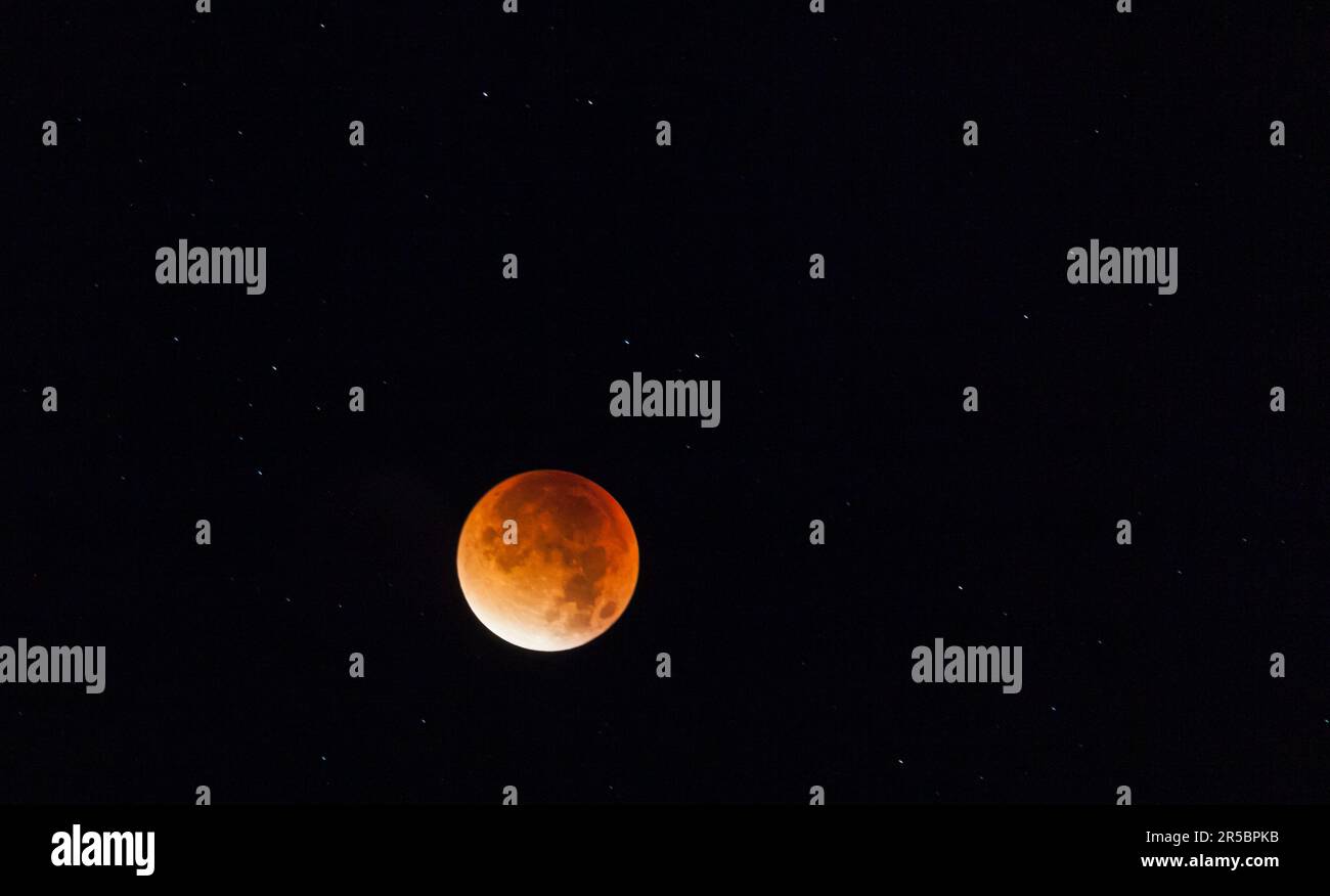 Close up picture of the blood moon during lunar eclipse at nighttime ...