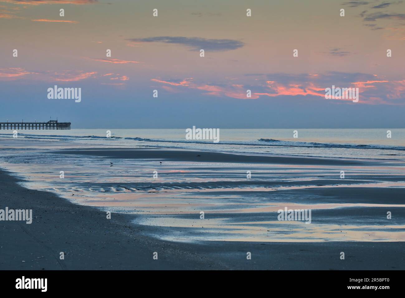 A scenic view of lingering tidal pools at Myrtle Beach, SC by the ...
