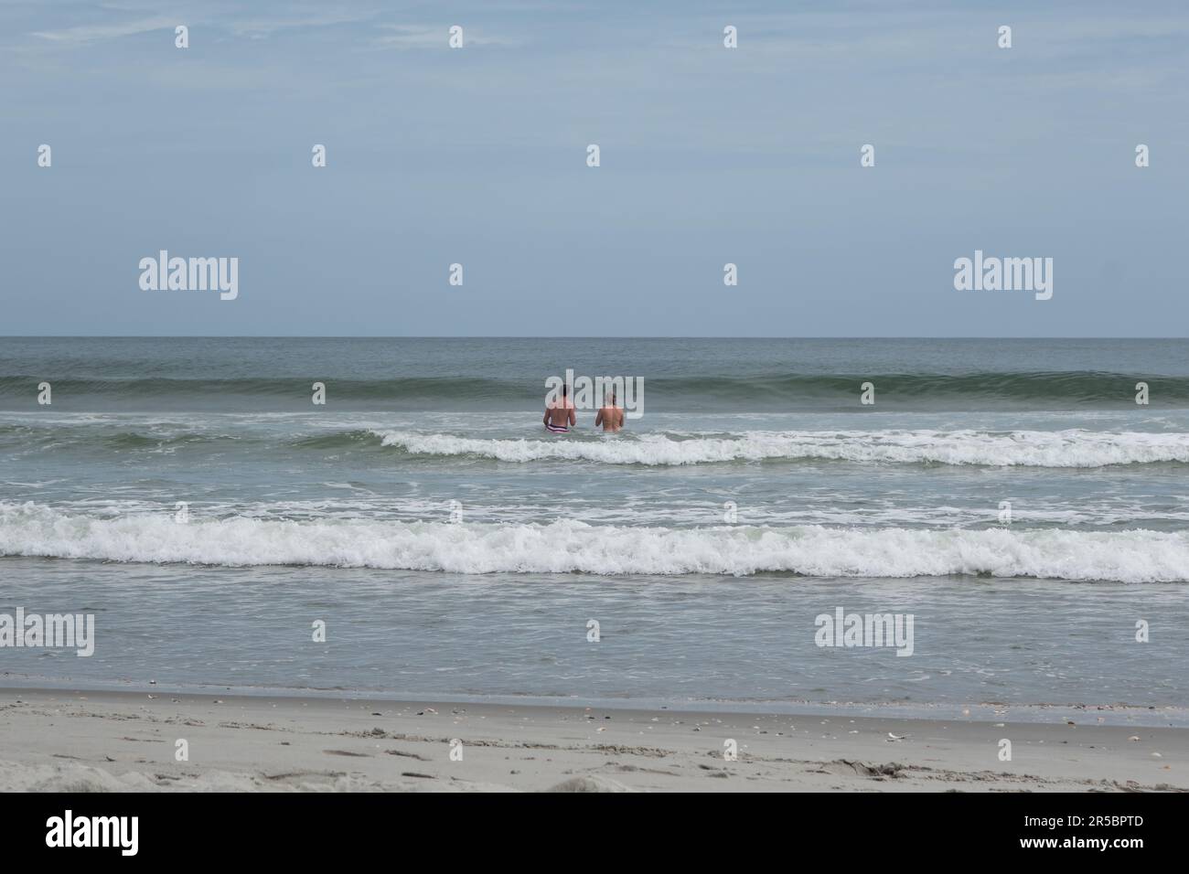 People swimming in the beautiful blue ocean of Myrtle Beach, South ...