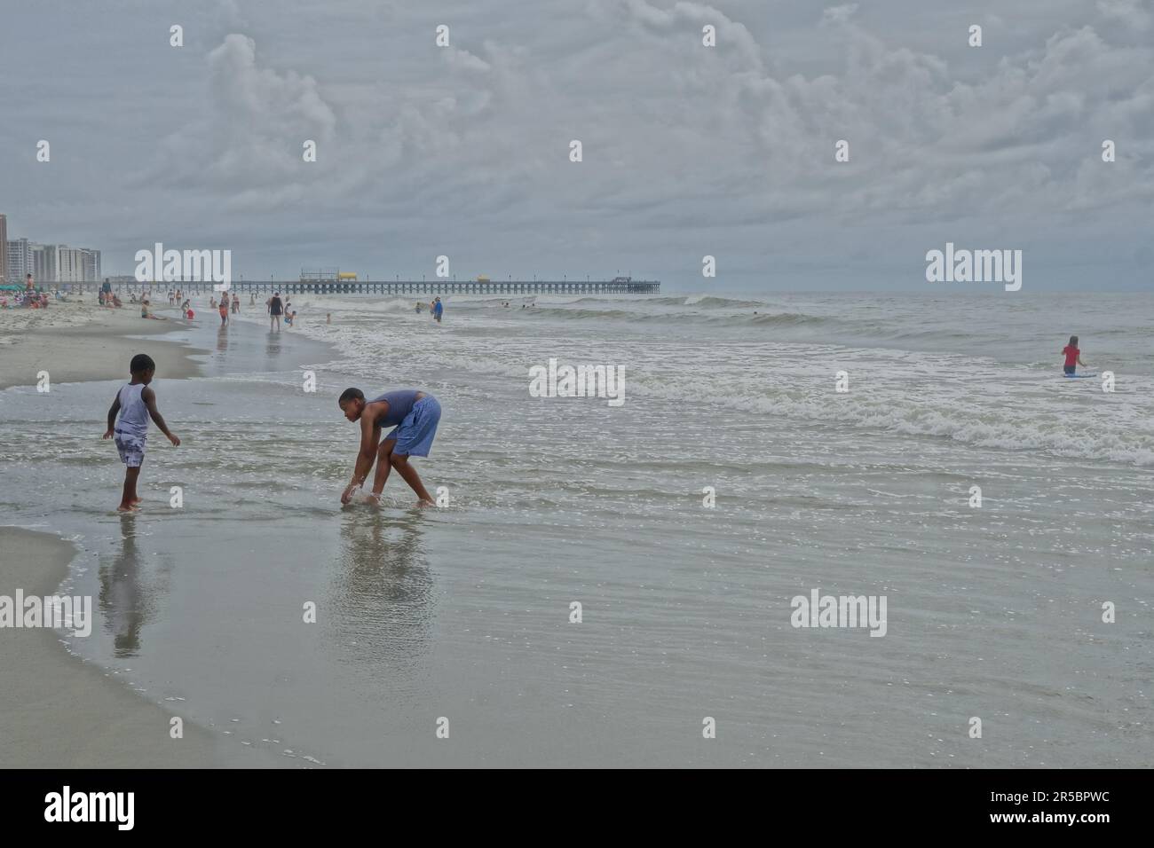 People swimming in the beautiful blue ocean of Myrtle Beach, South ...