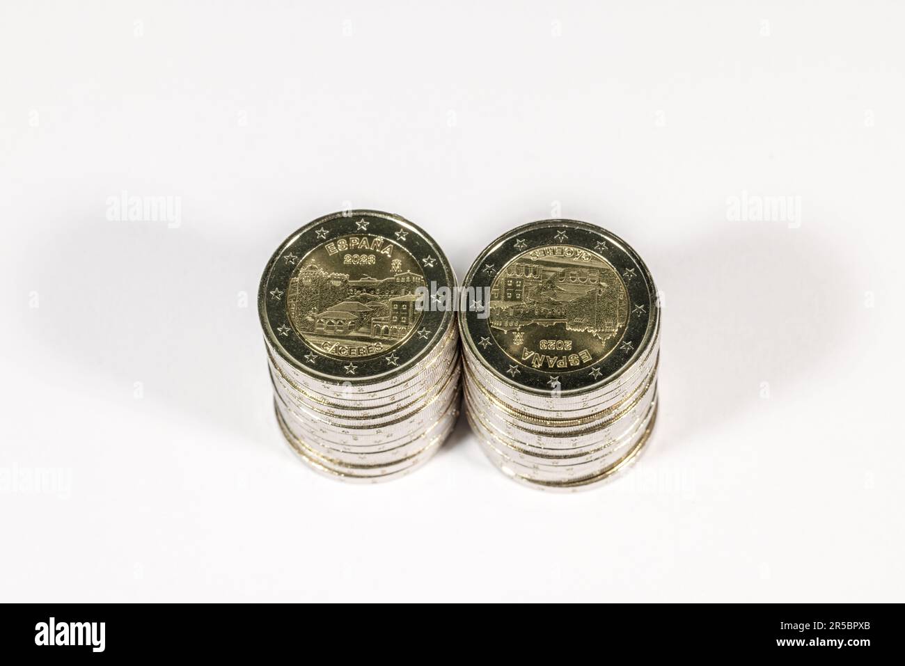 A stack of two euro coins minted in Spain on a white background Stock ...