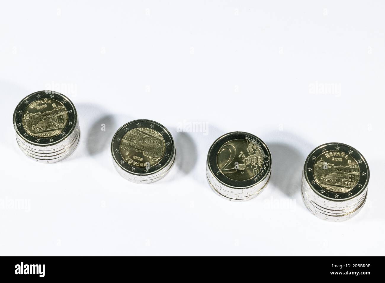 A stack of two euro coins minted in Spain on a white background Stock ...
