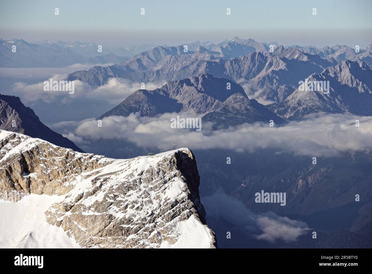 A scenic landscape of the Bavarian Alps in Germany blanketed in a layer ...