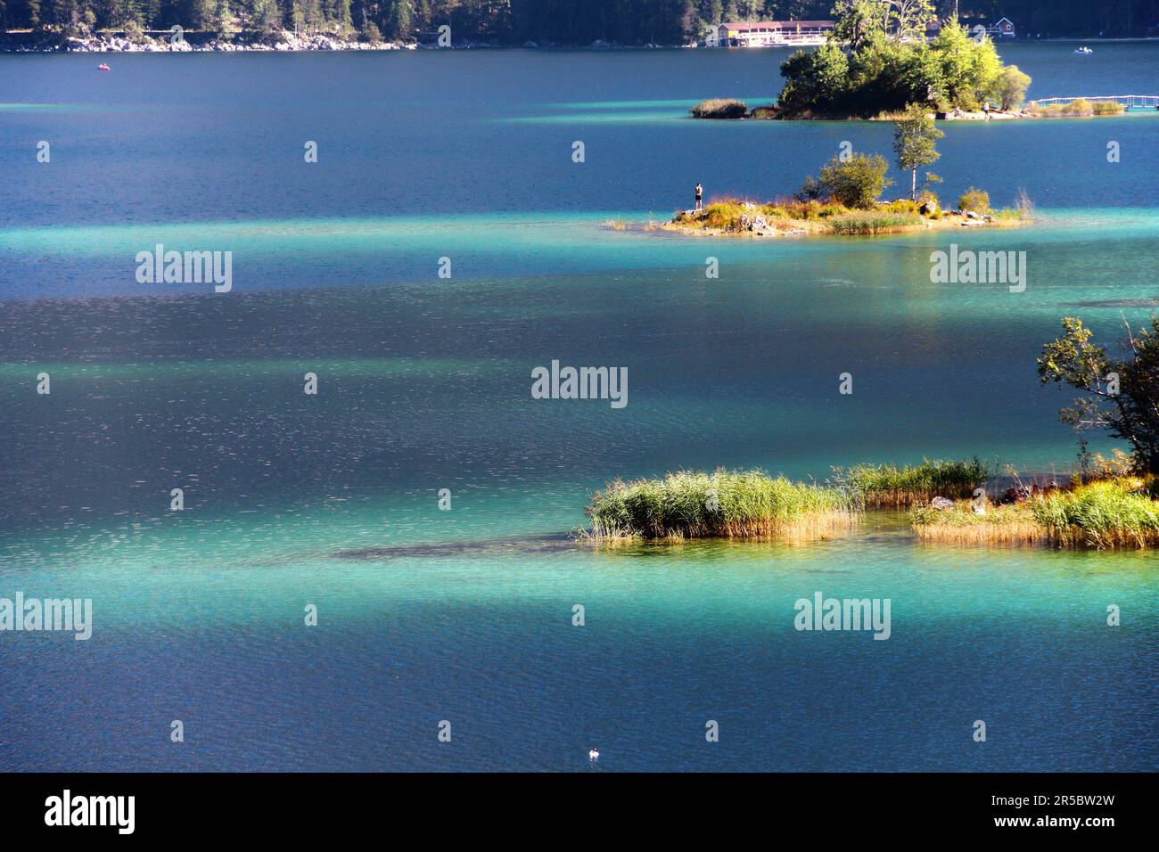 A tranquil scene of the lake Eib with blue and turquoise hues ...
