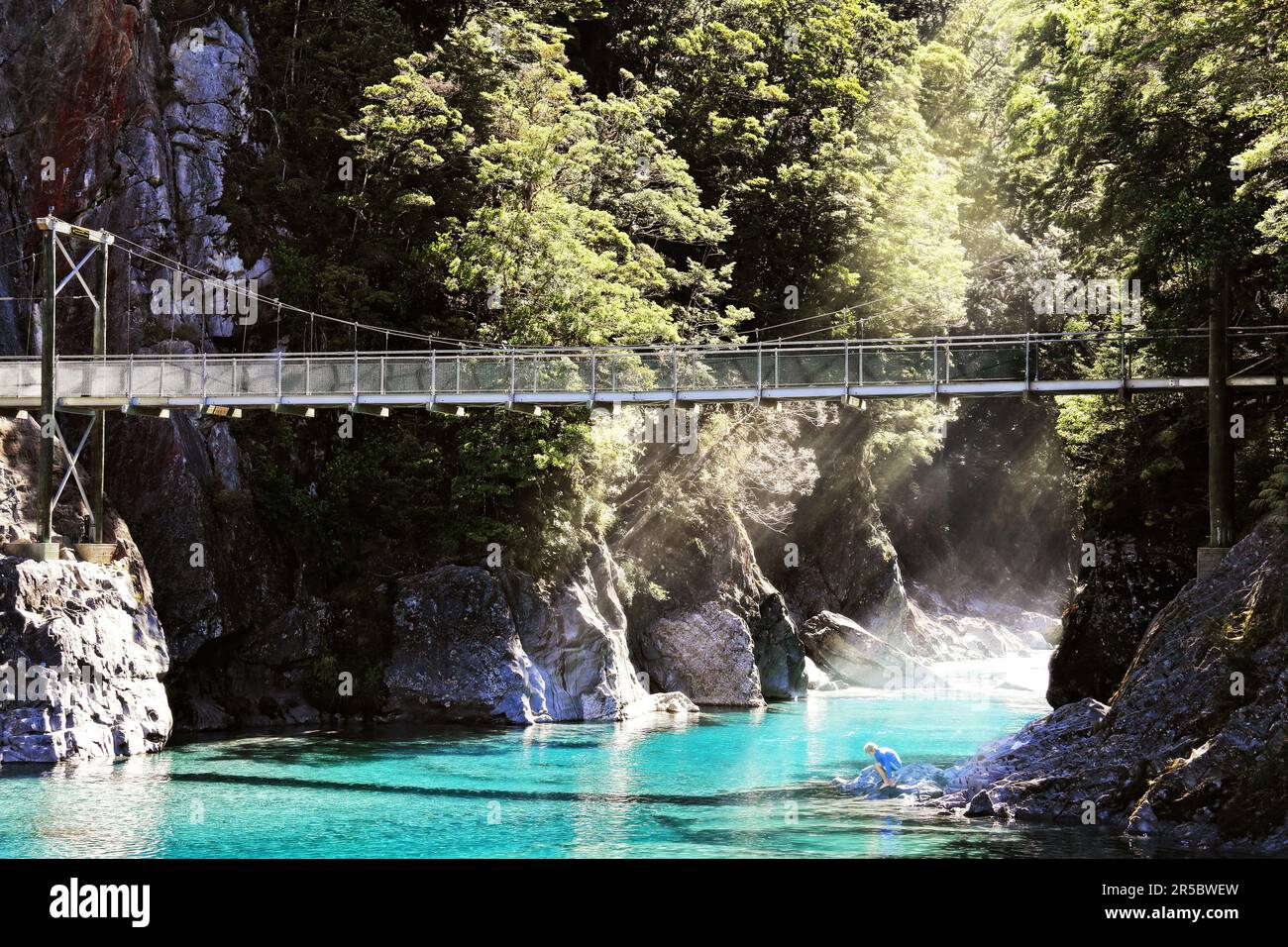 An aerial view of Haast Pass in New Zealand showcasing the vibrant blue ...
