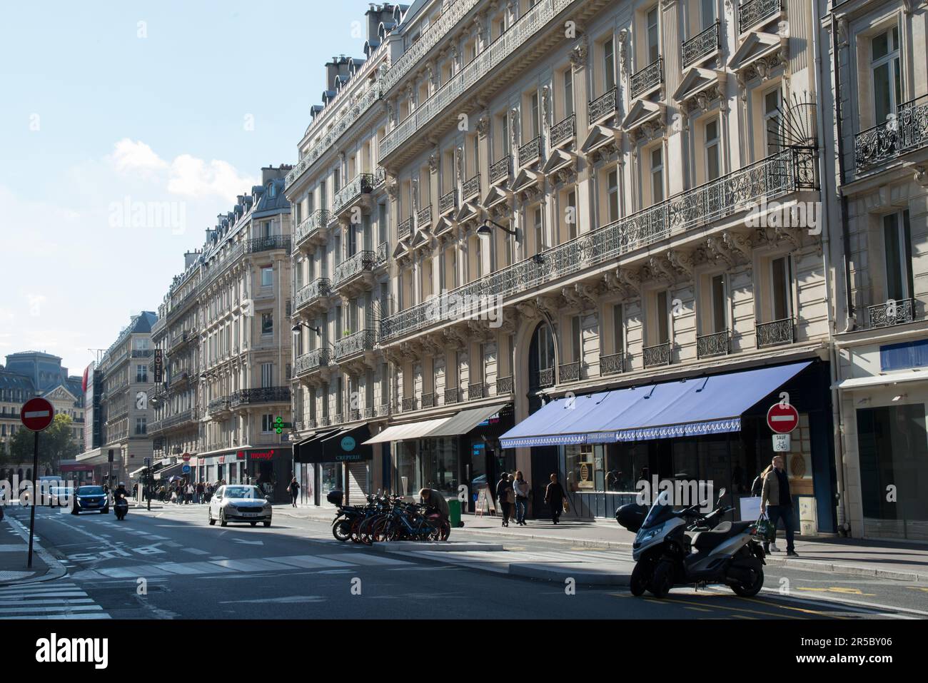 The streetlife in Paris, France with people walking on the street near ...