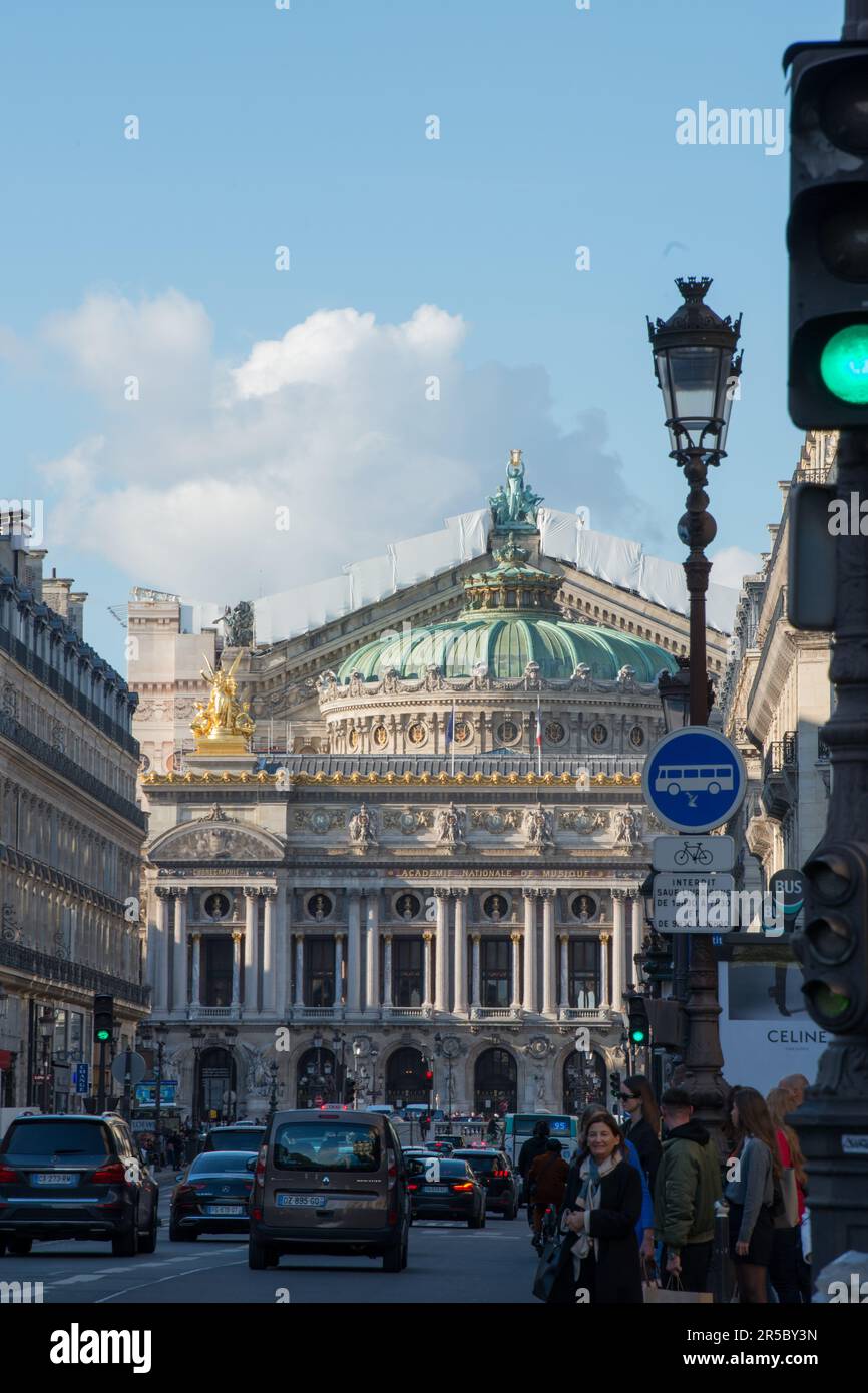 The Palais Garnier opera house in Paris, France with people and cars ...
