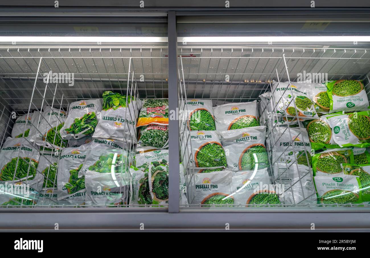 Italy - May 21, 2023: Frozen peas, green beans and spinach packed in ...