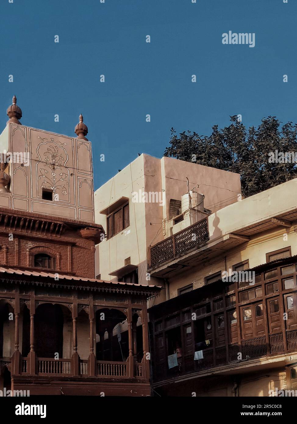 A sprawling brick building in a vibrant urban setting featuring a ...