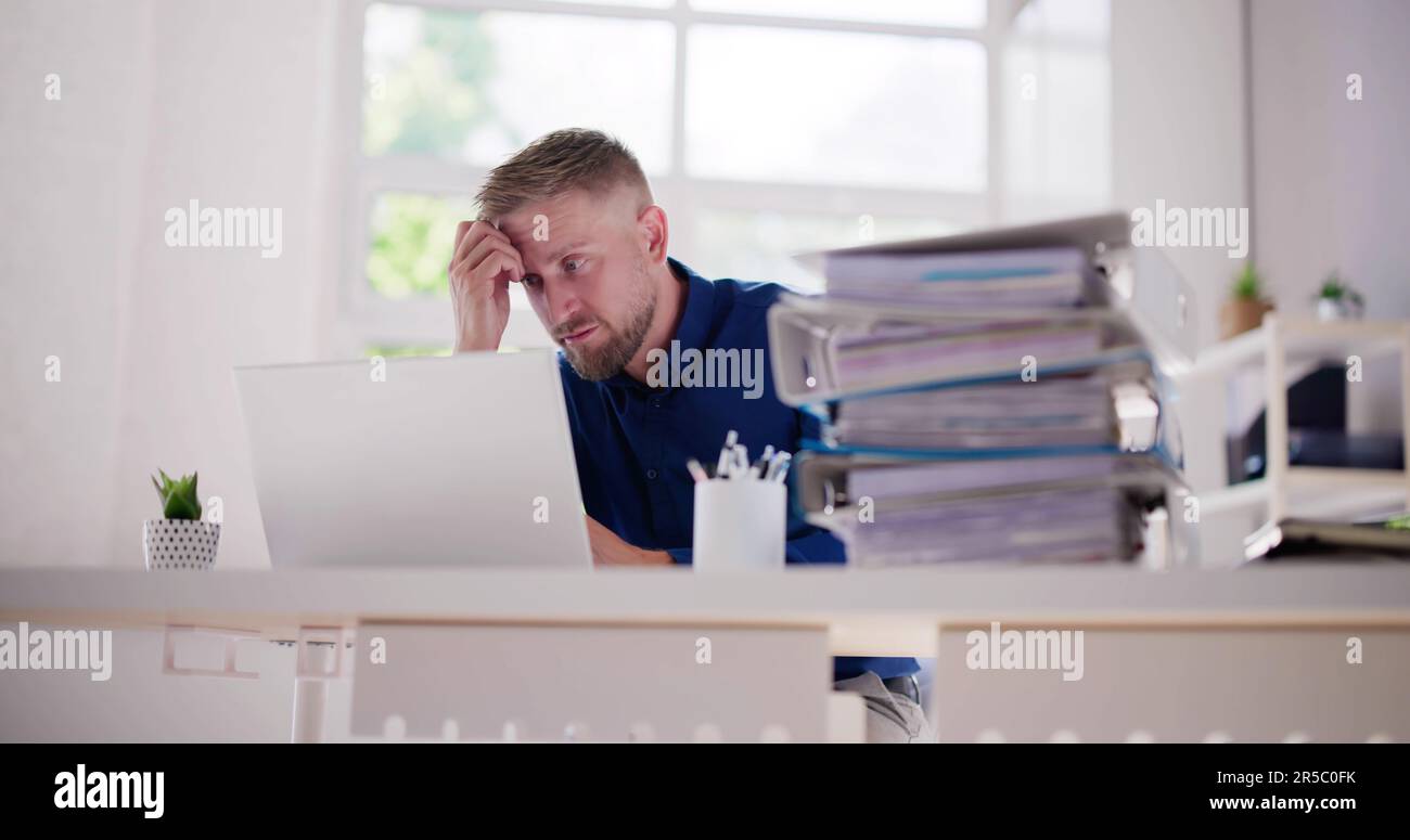 Business Man Tired And Stressed At Desk Stock Photo - Alamy