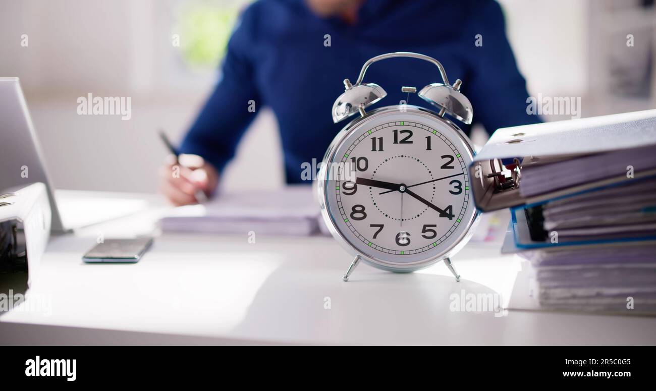 Accountant Calculating Bill With Time Clock. Money Alarm Stock Photo ...