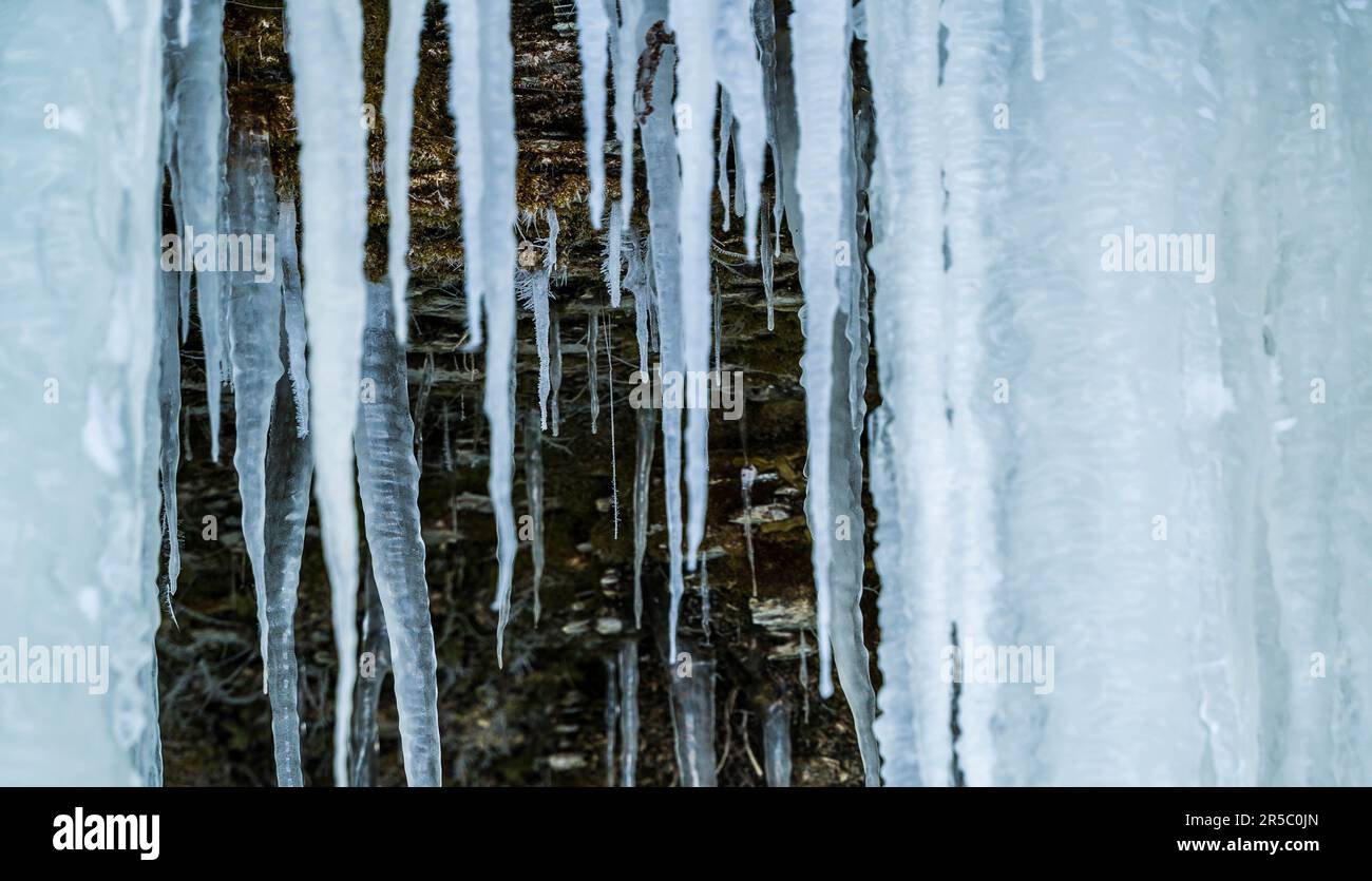 This stunning image captures a rocky landscape decorated with icicles ...