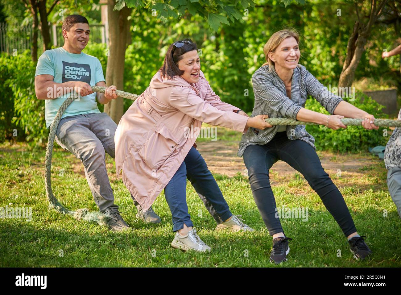 The people pulling the rope during an outdoor competition Stock Photo ...