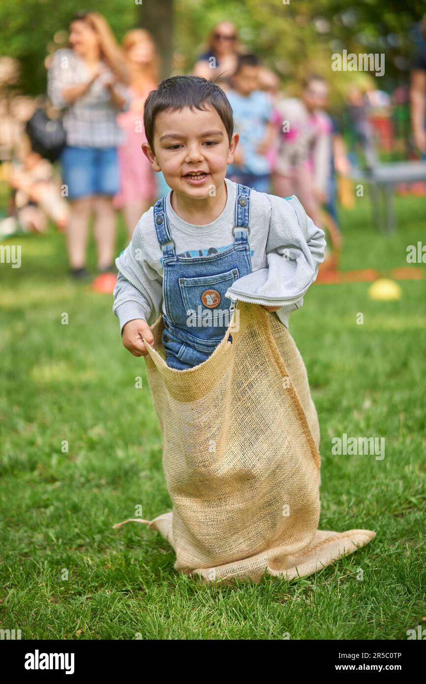A young boy during an outdoor jumping bag competition in Poznan Stock ...