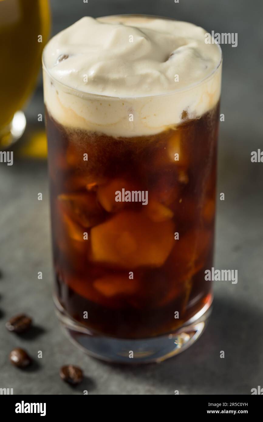 Cold Oleato Olive Oil Iced Coffee in a Cup Stock Photo - Alamy