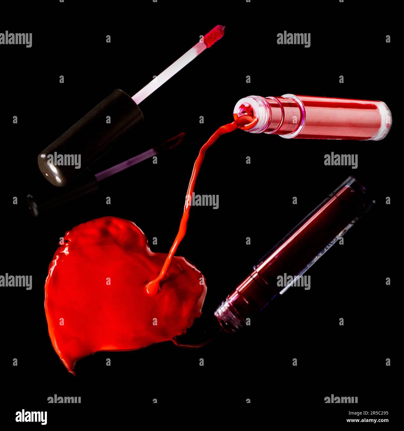 A ripe red apple falling towards a pair of full lips, creating a ...
