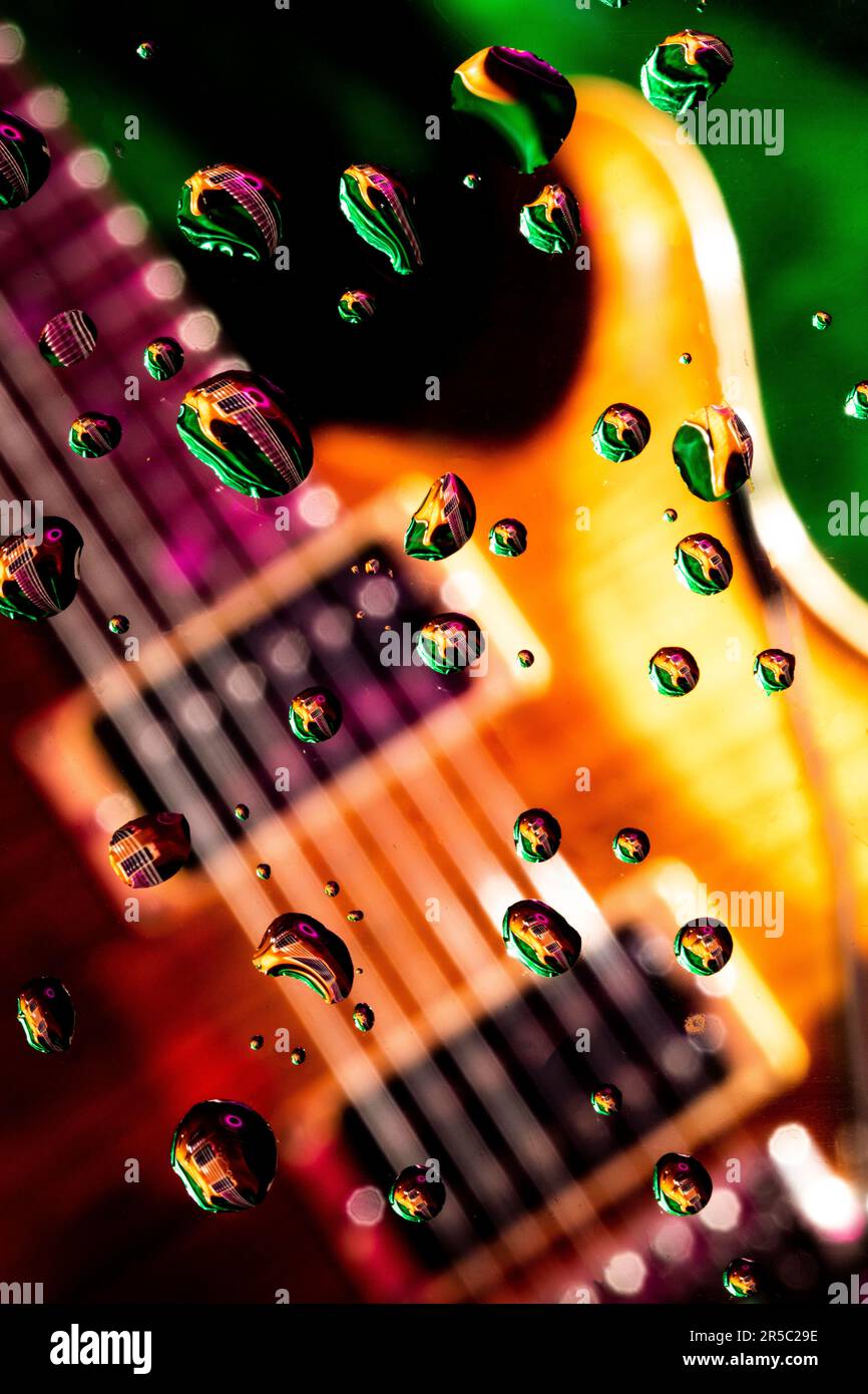 A vibrant electric guitar is displayed in a colorful composition Stock Photo - Alamy