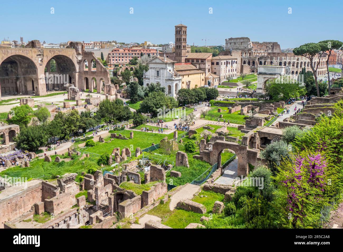 Aerial panoramic view of the ruins of the Roman Forum with Colosseum in ...