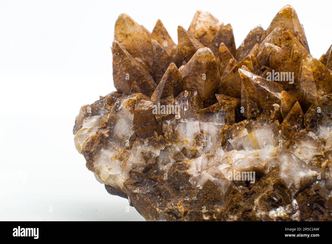 A high-resolution close-up image of a brown crystal with intricate ...