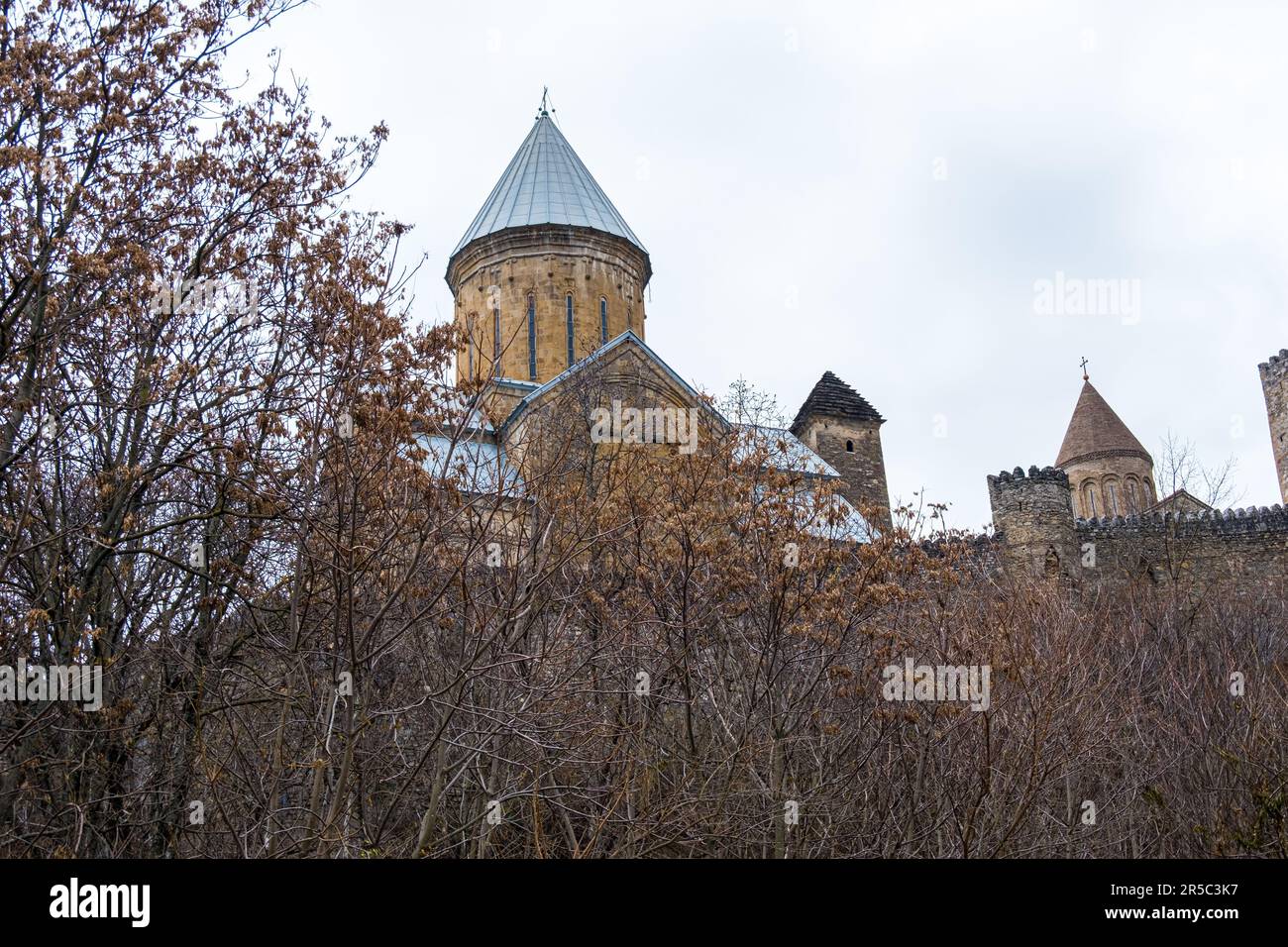 This image is of a towering, imposing structure situated against a ...