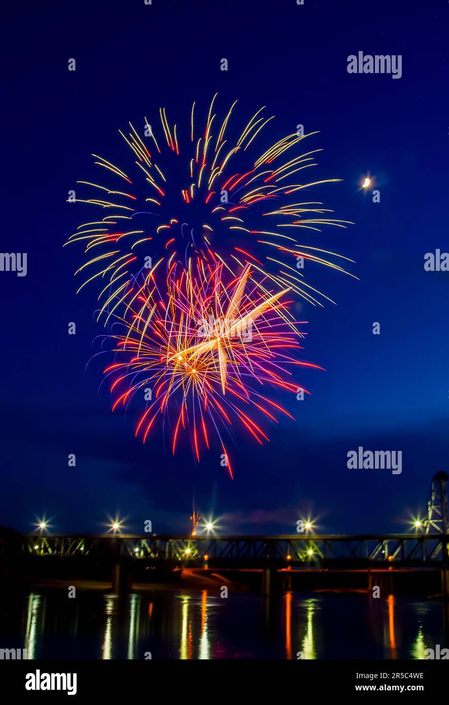 The vibrant festive fireworks over the Meridian Highway Bridge at night ...