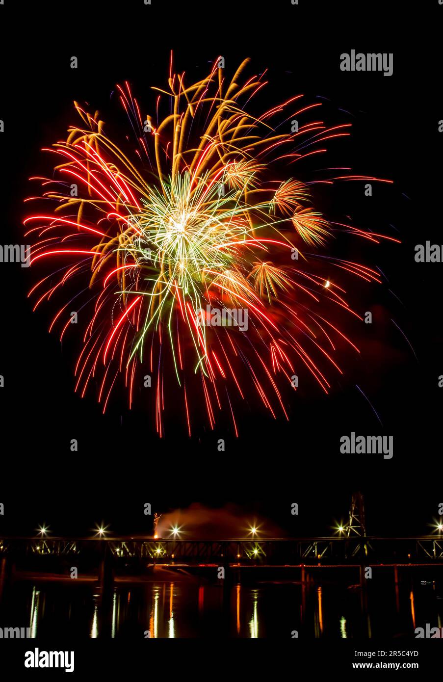 The vibrant festive fireworks over the Meridian Highway Bridge at night ...