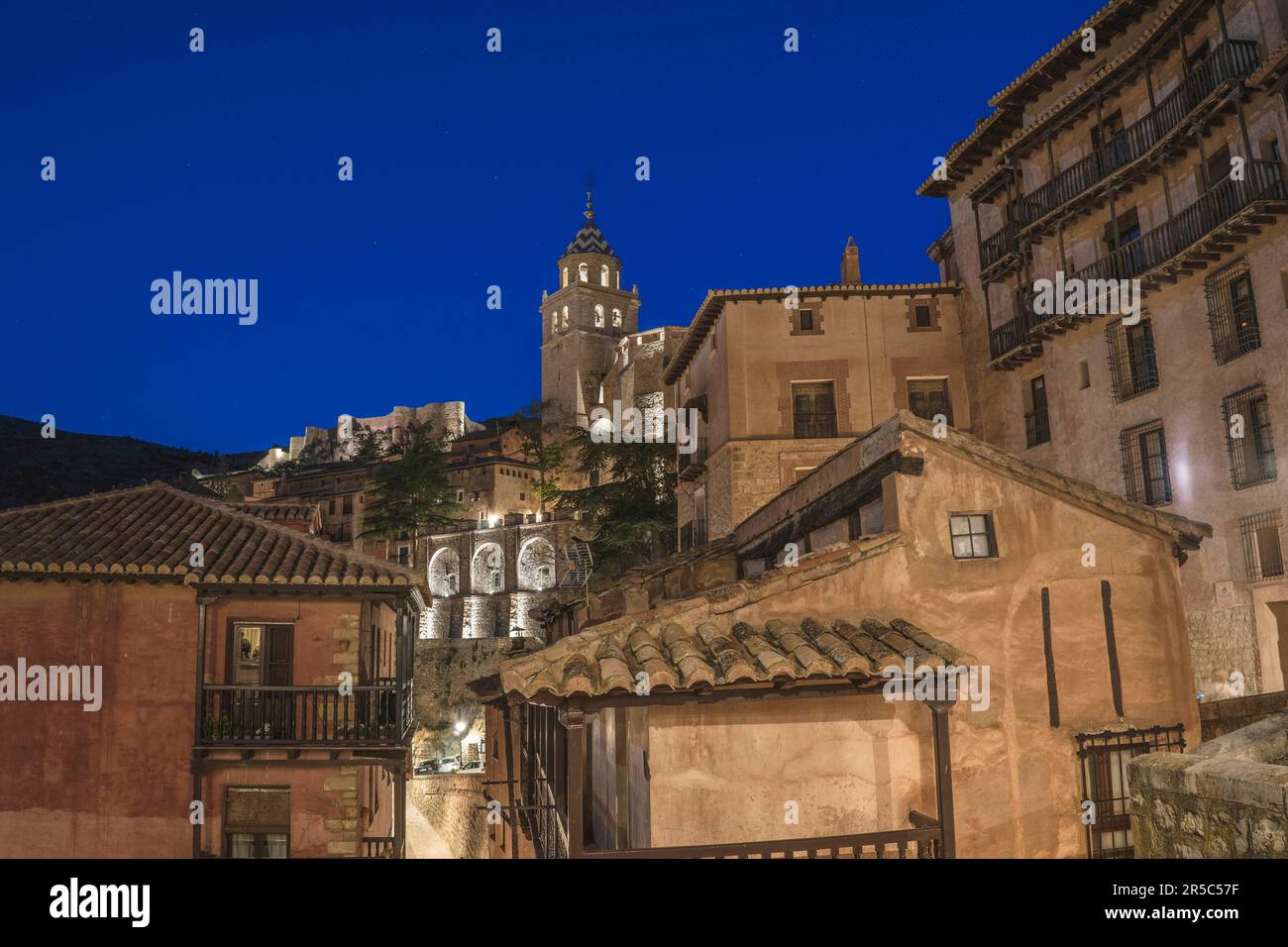Church and medieval houses of Albarracin at night. Albarracin is one of ...