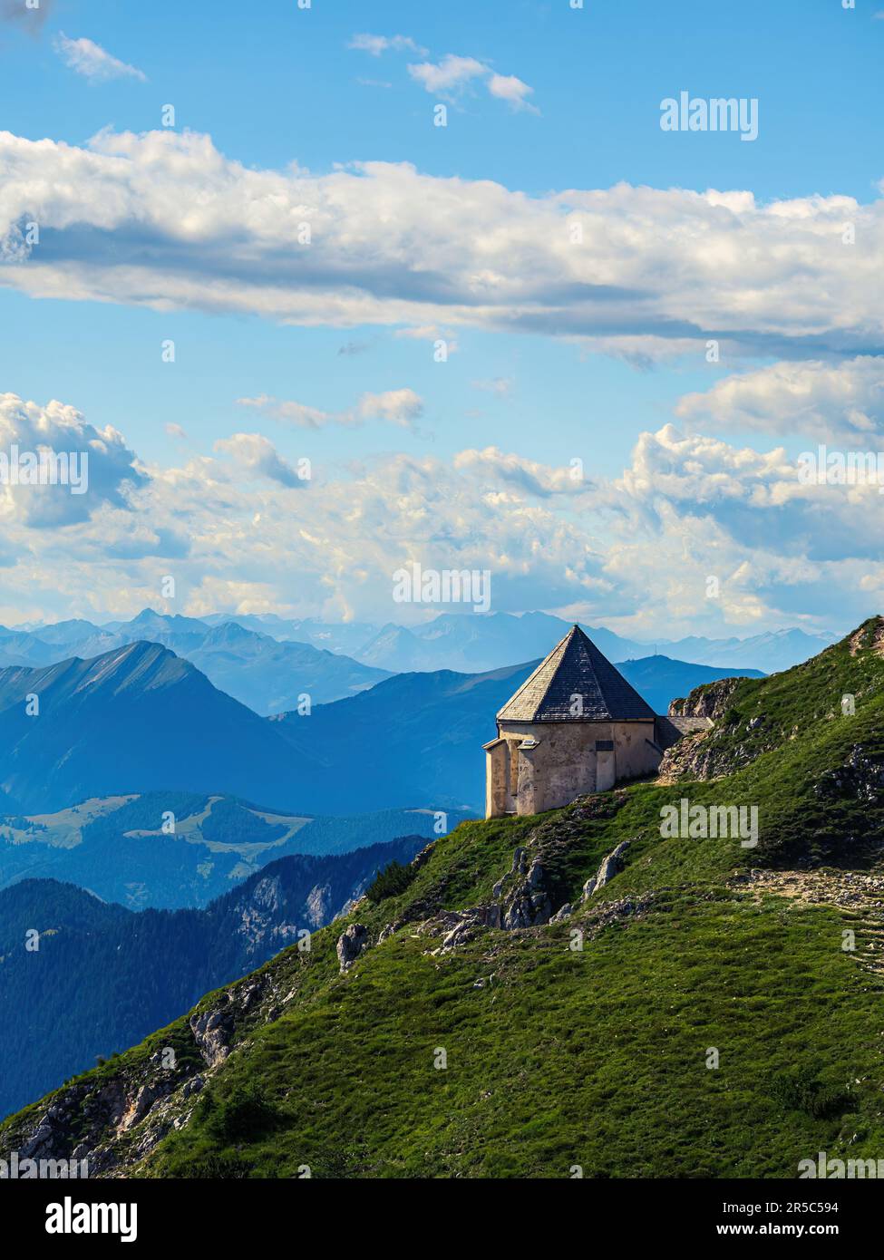 Small mountain chapel on a cliff with beautiful scenery lookout summer ...