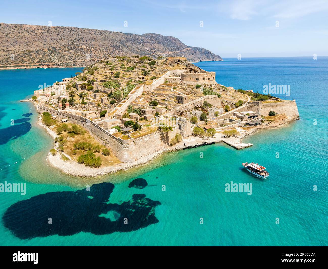 Aerial drone view of Spinalonga island with calm sea. Old venetian ...