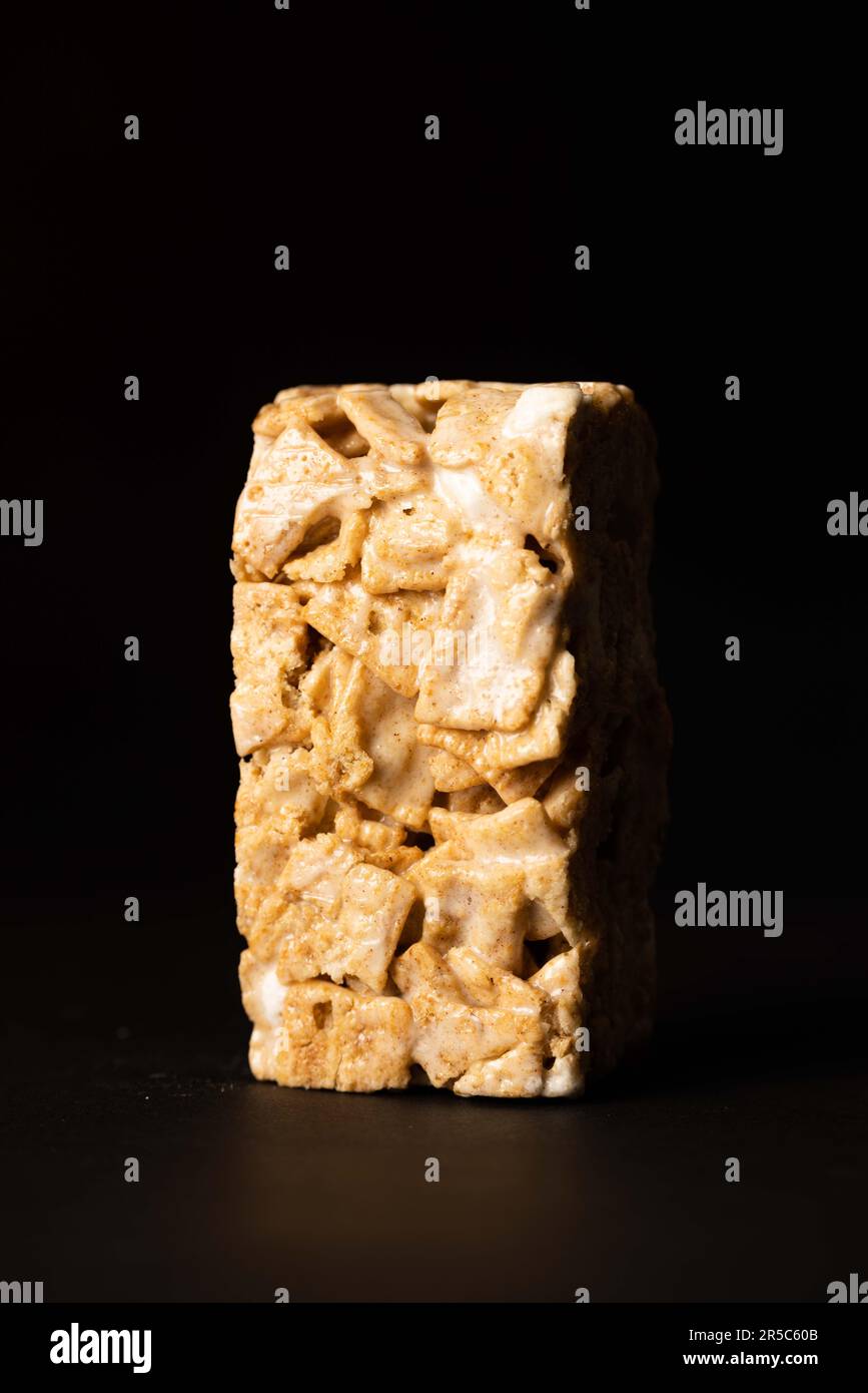 A modern cubic shaped object set against a black background Stock Photo ...