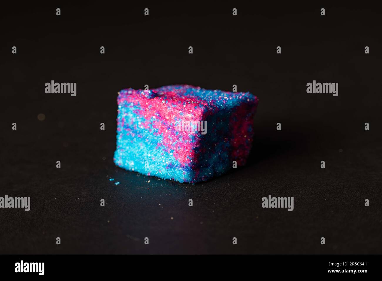 High-resolution image of a single sugar cube with a unique blue and ...