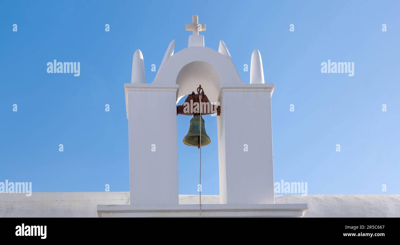 Small orthodox church belfry, white color chapel roof on clear blue sky ...