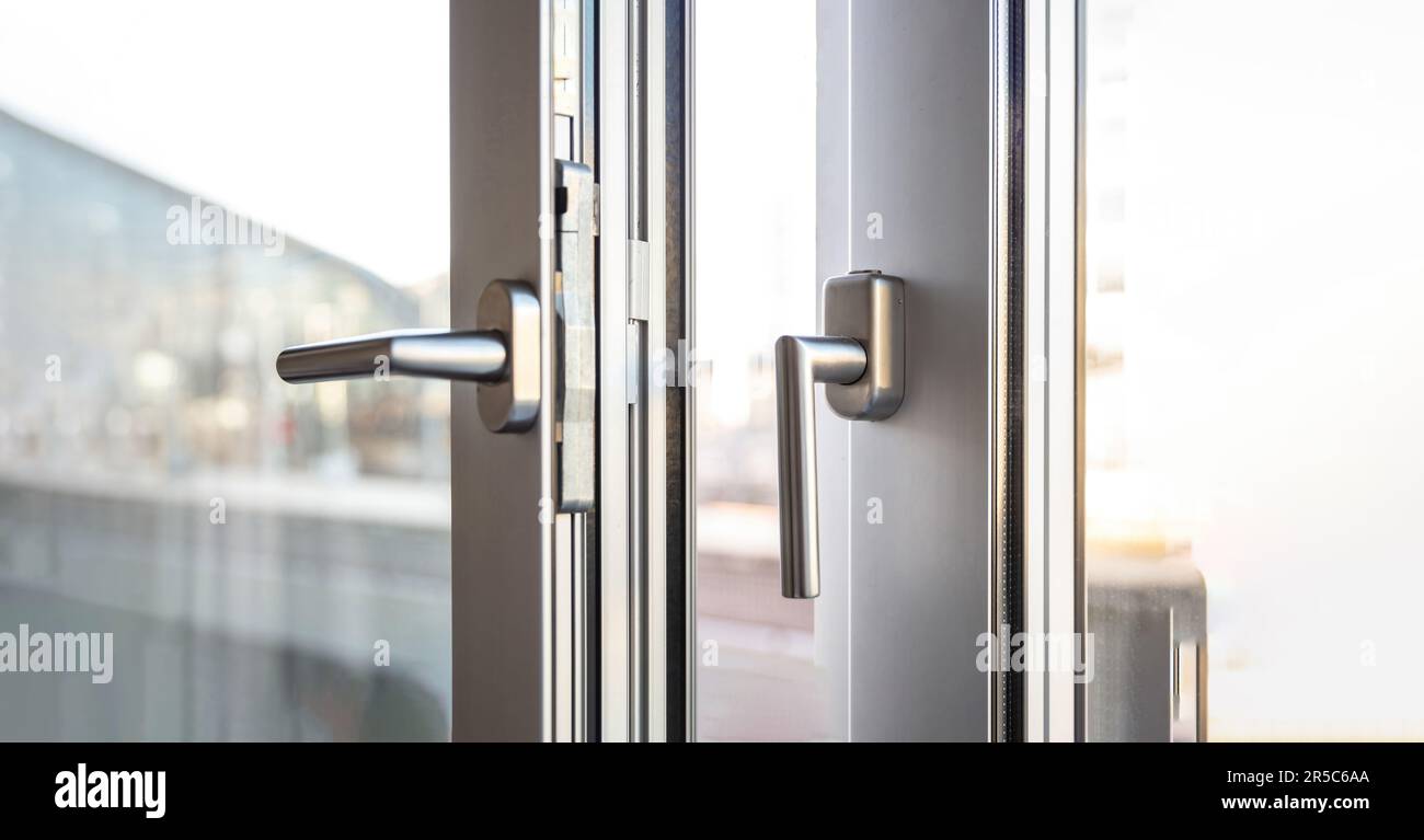 PVC and metal window close up, aluminum door window gray silver color ...