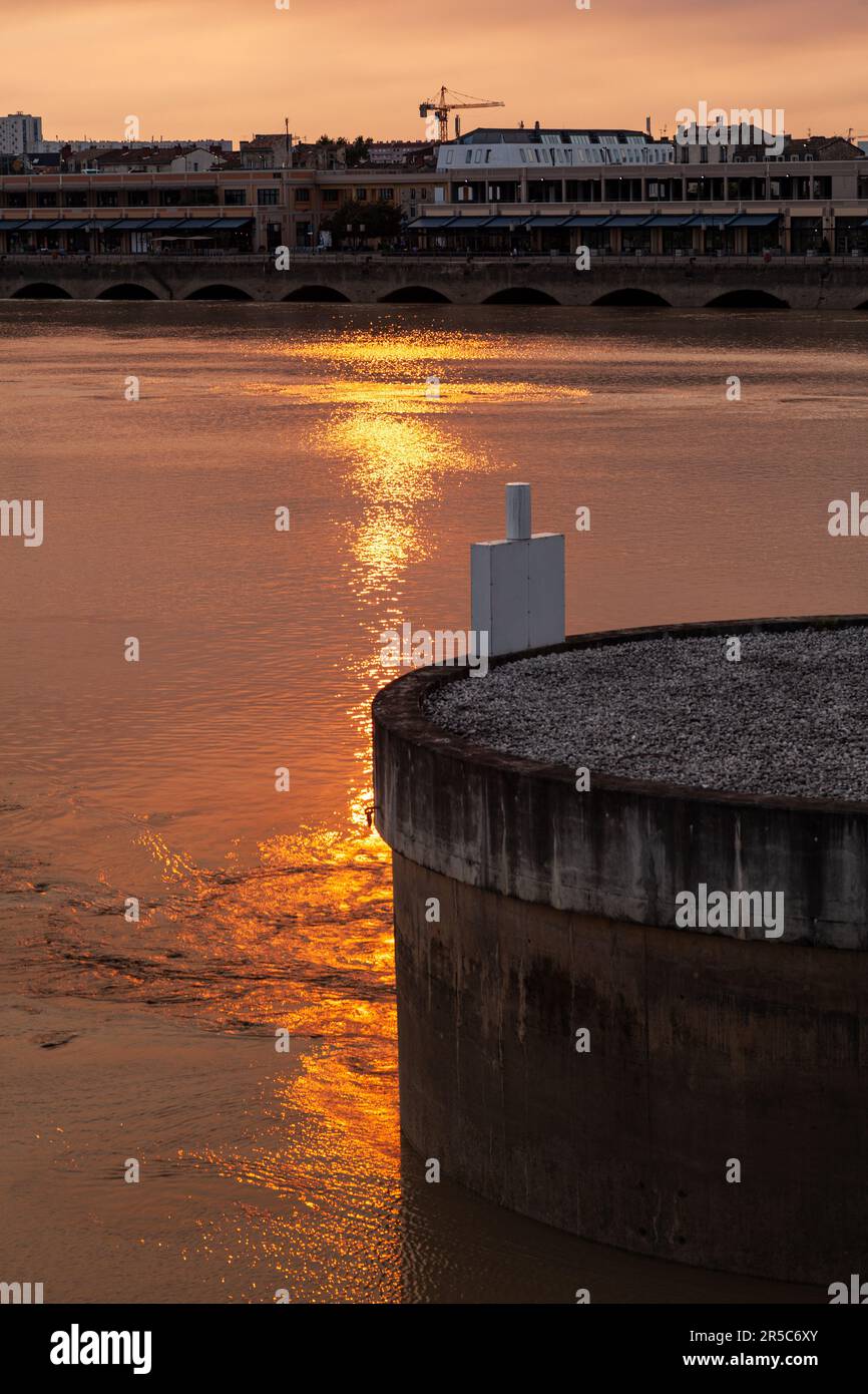 Metallic sunlight on the water. Orange reflection in the water of the ...