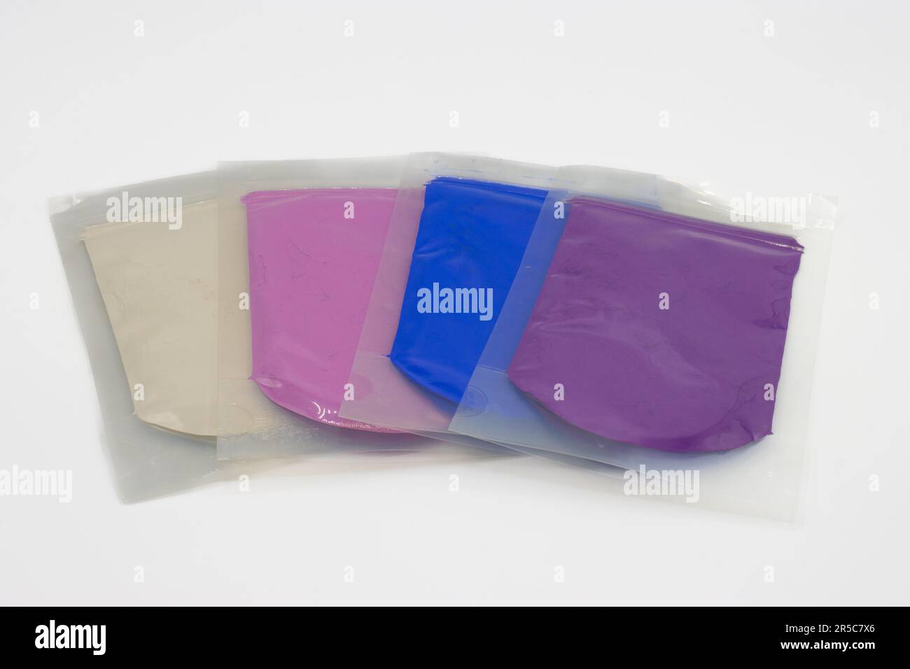 Colored cosmetic mica powder bags Stock Photo - Alamy