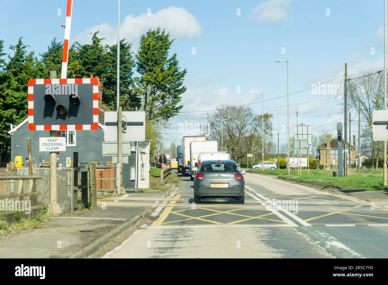 Railway level crossing with lights and barriers at Swineshead bridge on ...
