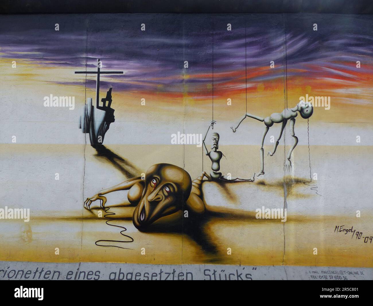 An urban street scene featuring a graffiti mural of a man running away ...