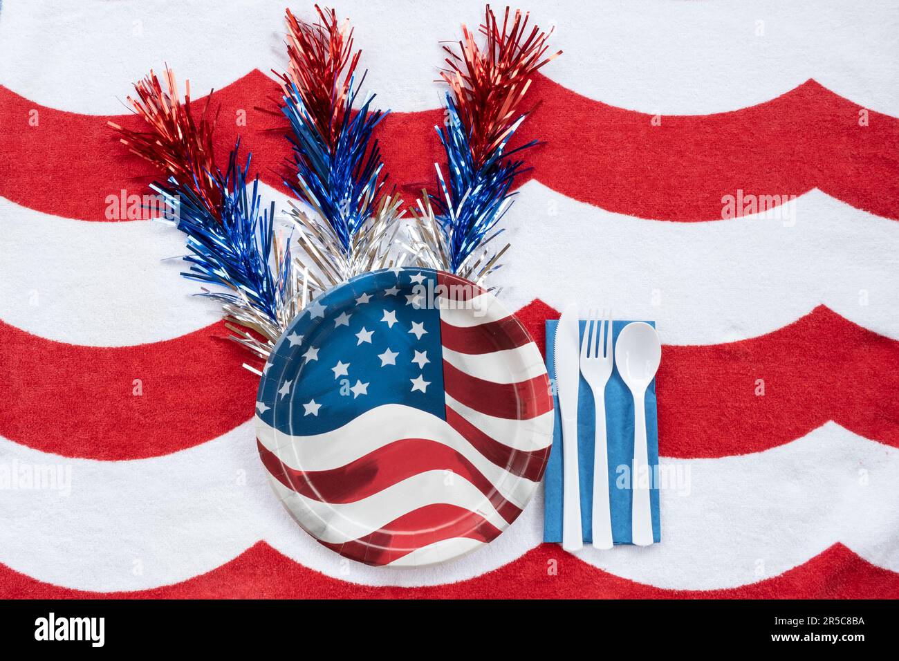 Red, white and blue paper plate picnic setting on red and white ...