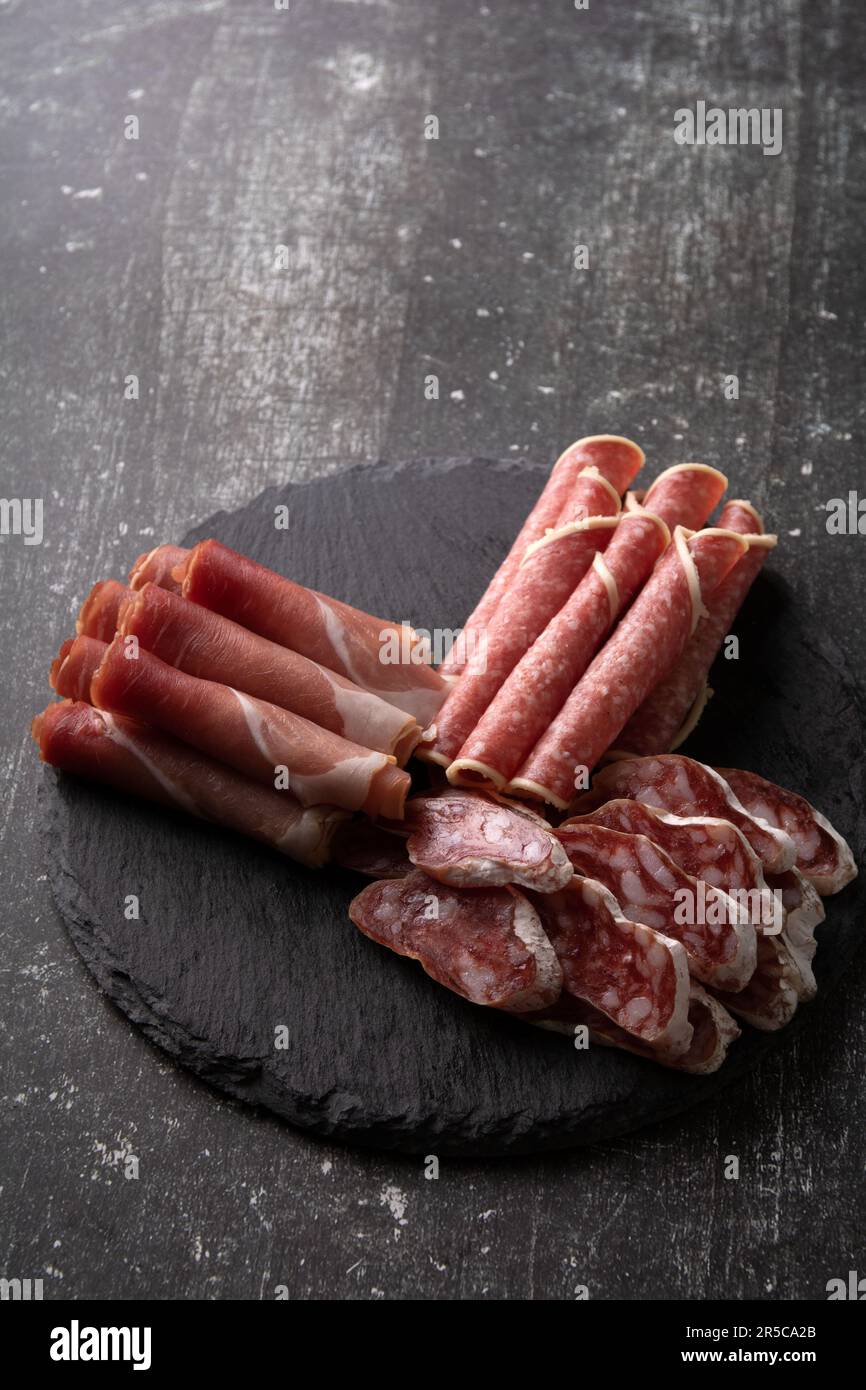 photo of sliced meat lying on a flat plate Stock Photo - Alamy