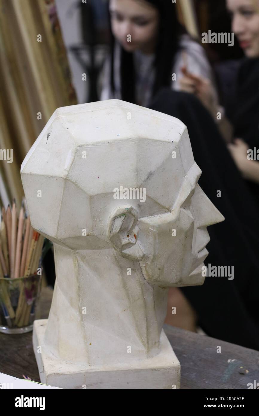 photo plaster head for drawing on the table as seen from the side Stock Photo - Alamy