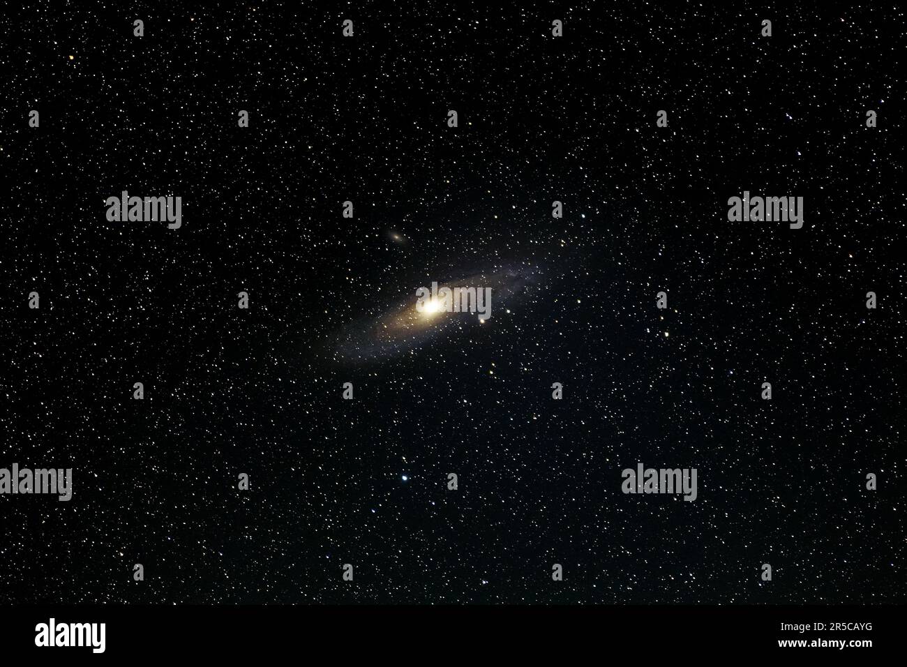 A celestial body featuring a spiral galaxy with a distinct center and ...
