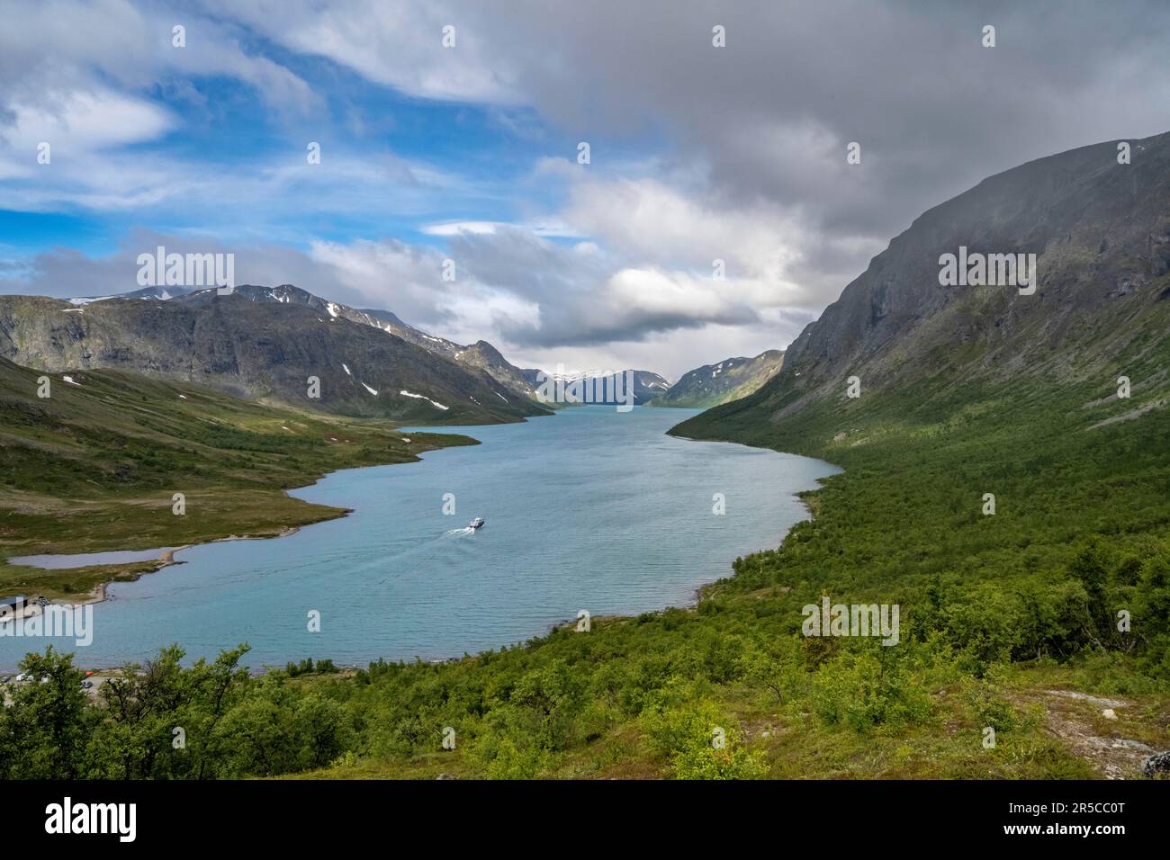 View of lake Gjende with boat, Besseggen hike, ridge walk, Jotunheimen ...