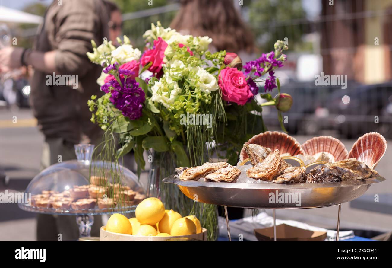 The selection of French delicacies, focused on metal bowl with fresh ...