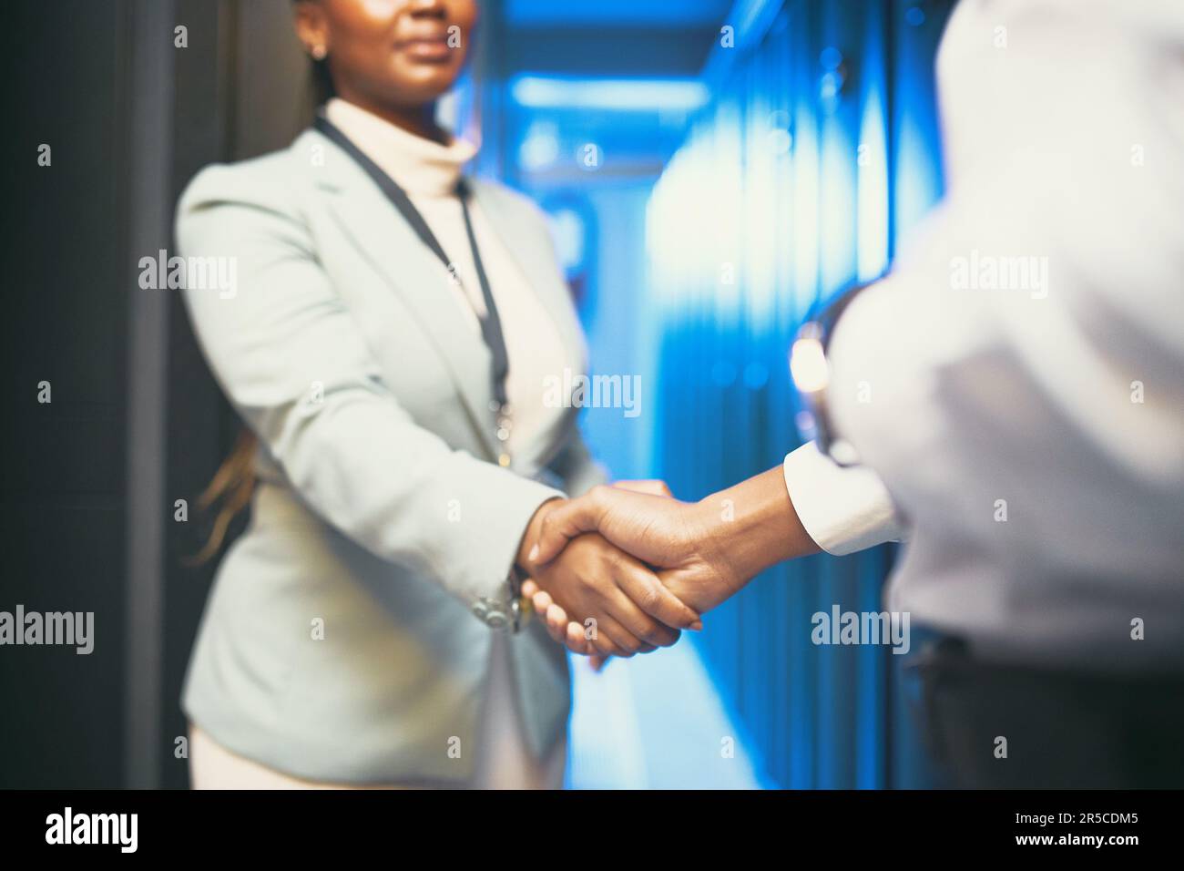 Were coming together for a technological future. two unrecognizable IT ...