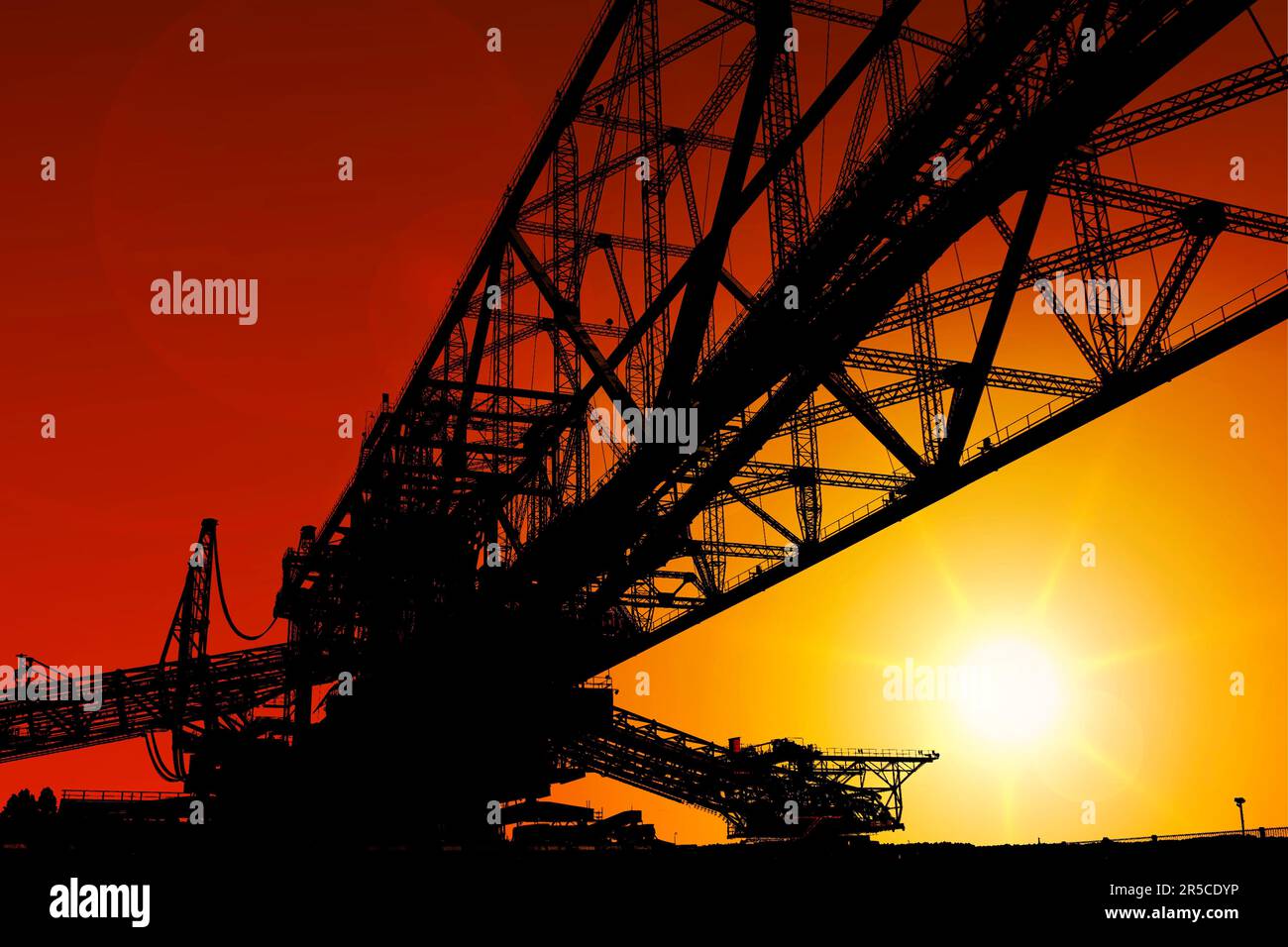 Coal mining conveyor bridge with sun in background Stock Photo - Alamy