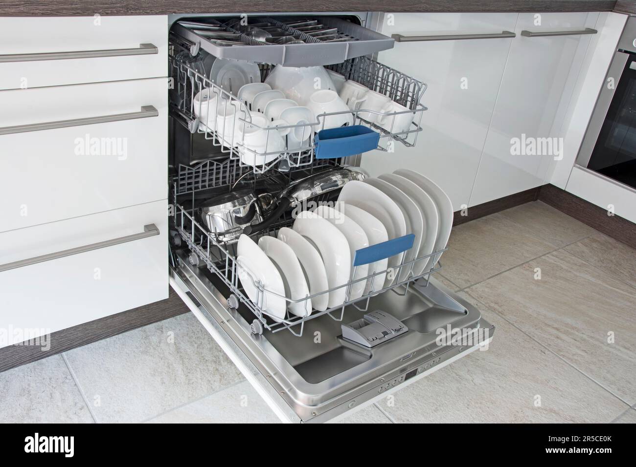 Open modern dishwasher with clean dishes Stock Photo - Alamy