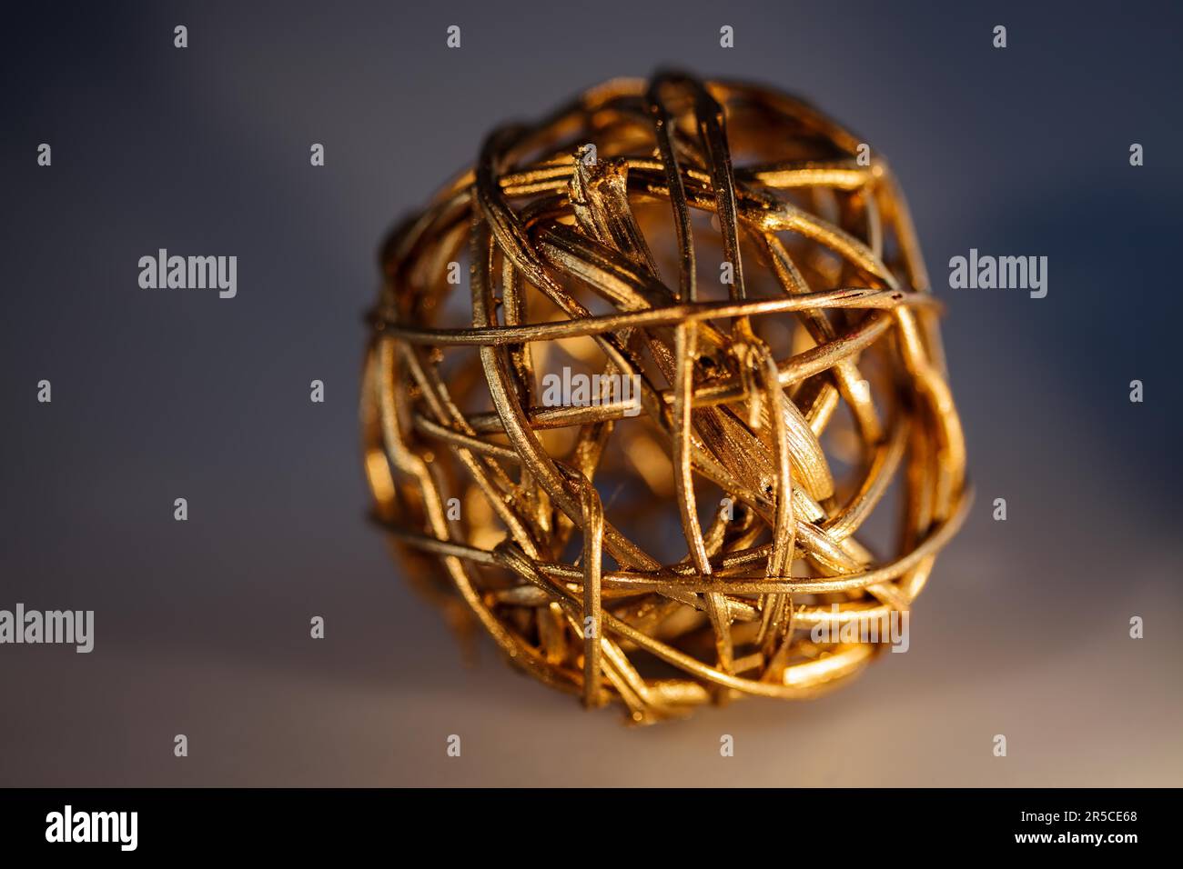 Sphere of pliable twigs painted gold to form a decorative object Stock ...