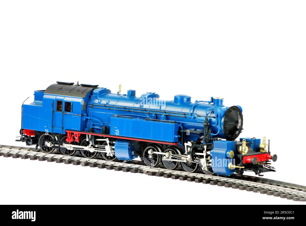 Isolated toy steam locomotive with a coal trailer Stock Photo - Alamy