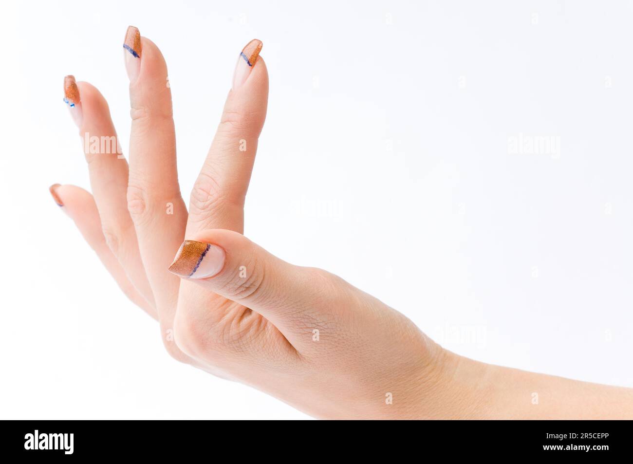 Beautiful female manicured colourful fingernails against a white ...